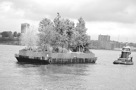 Just like any other barge, only this one has bark and leaves – amNewYork