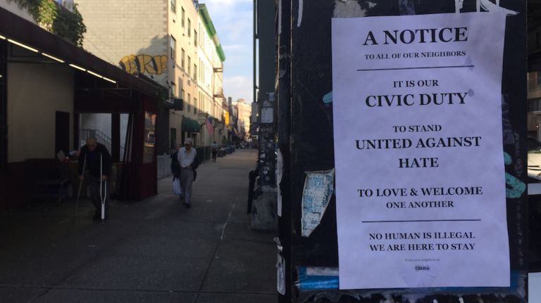 Pro-immigrant posters appear in Queens after hateful flyers spark ...
