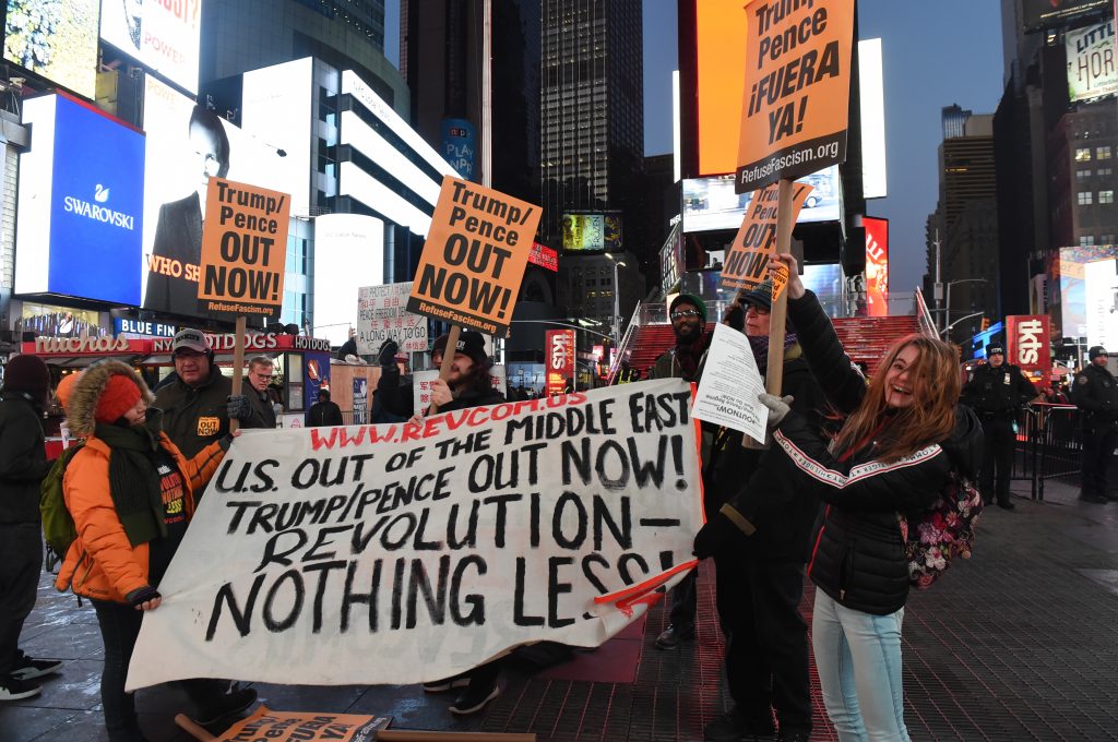 Fearing outbreak of war, protesters rally in Times Square against Trump ...