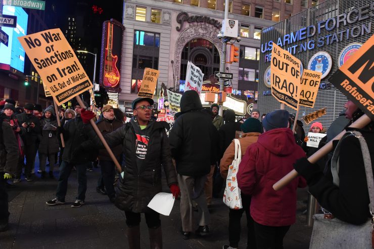 Fearing outbreak of war, protesters rally in Times Square against Trump ...