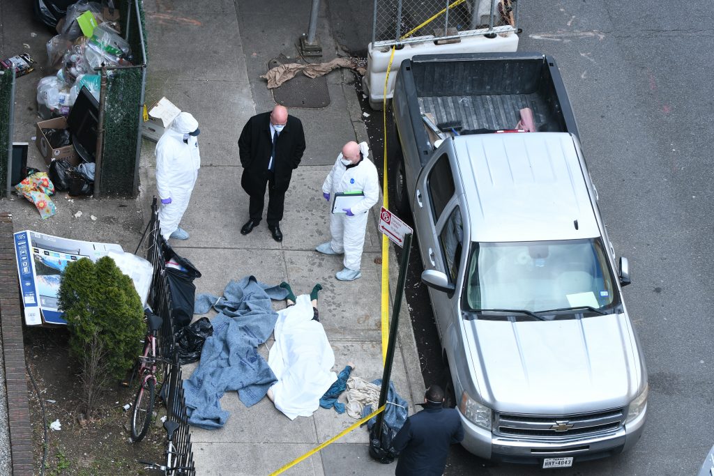 Man in custody after woman was found wrapped in tarp and dumped on ...