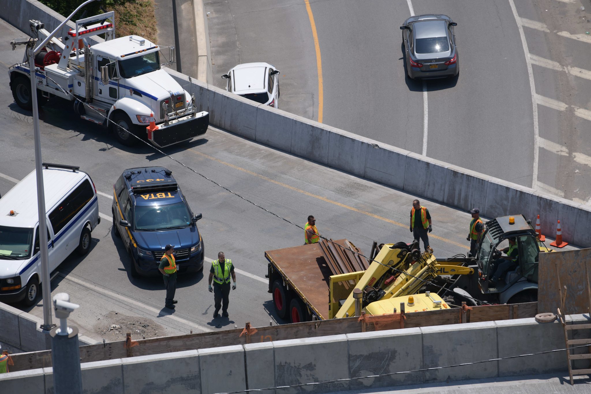 Two injured, traffic jammed in overturn truck with steel girders off ...
