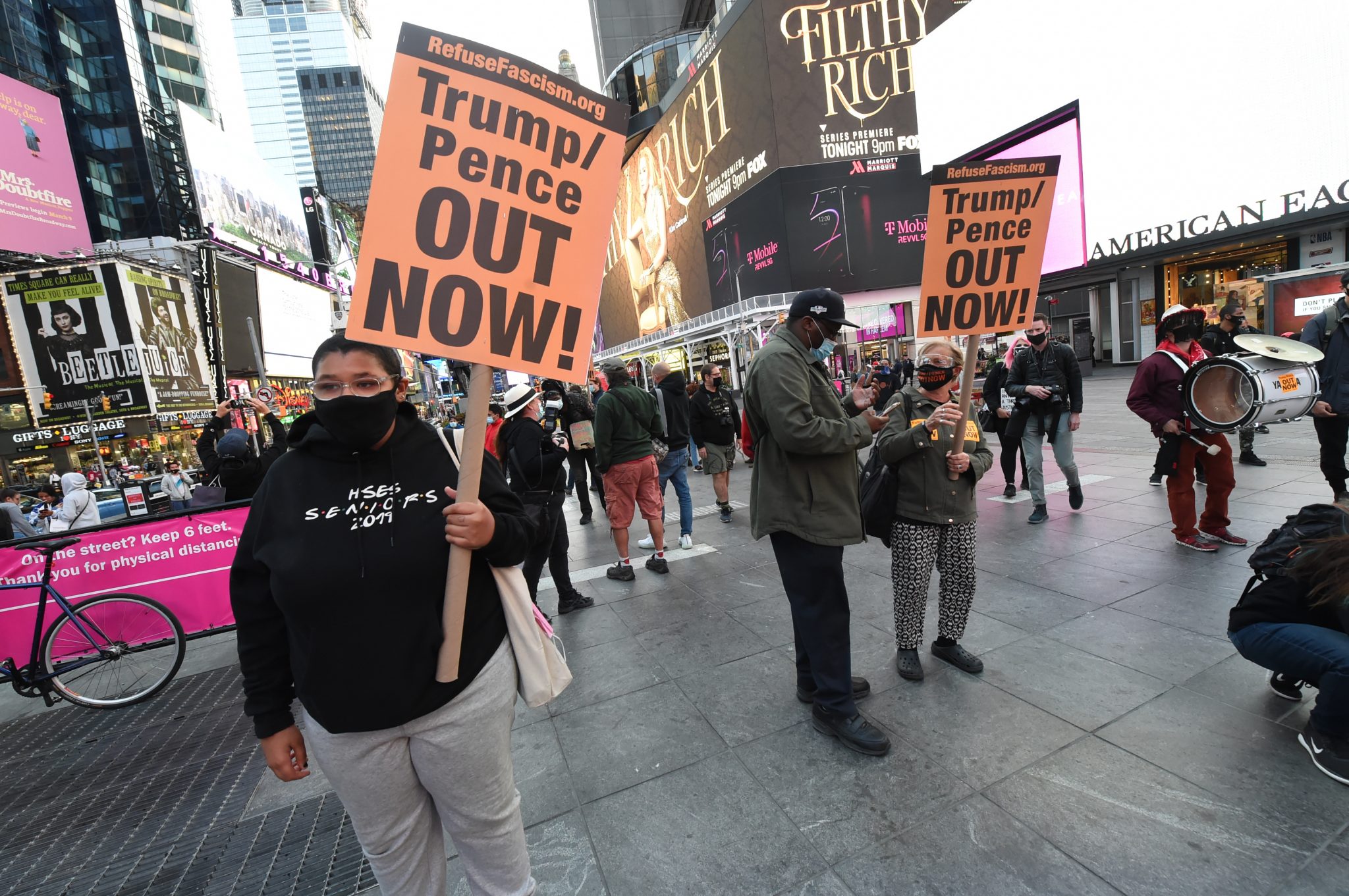 ‘We must rise now’: Times Square rally highlights 200,000 deaths from ...