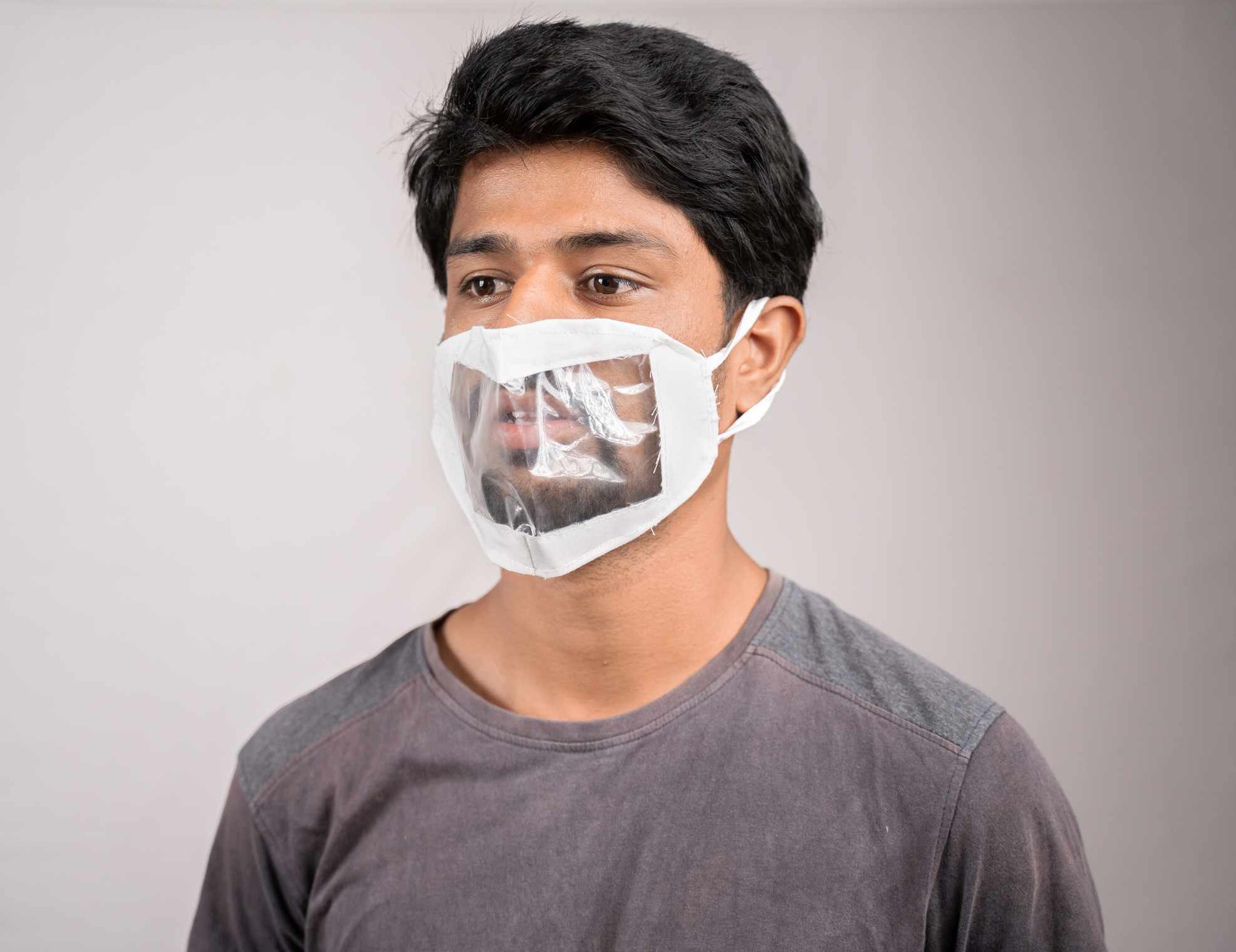 City pledges to distribute 100,000 clear plastic face masks to help ...