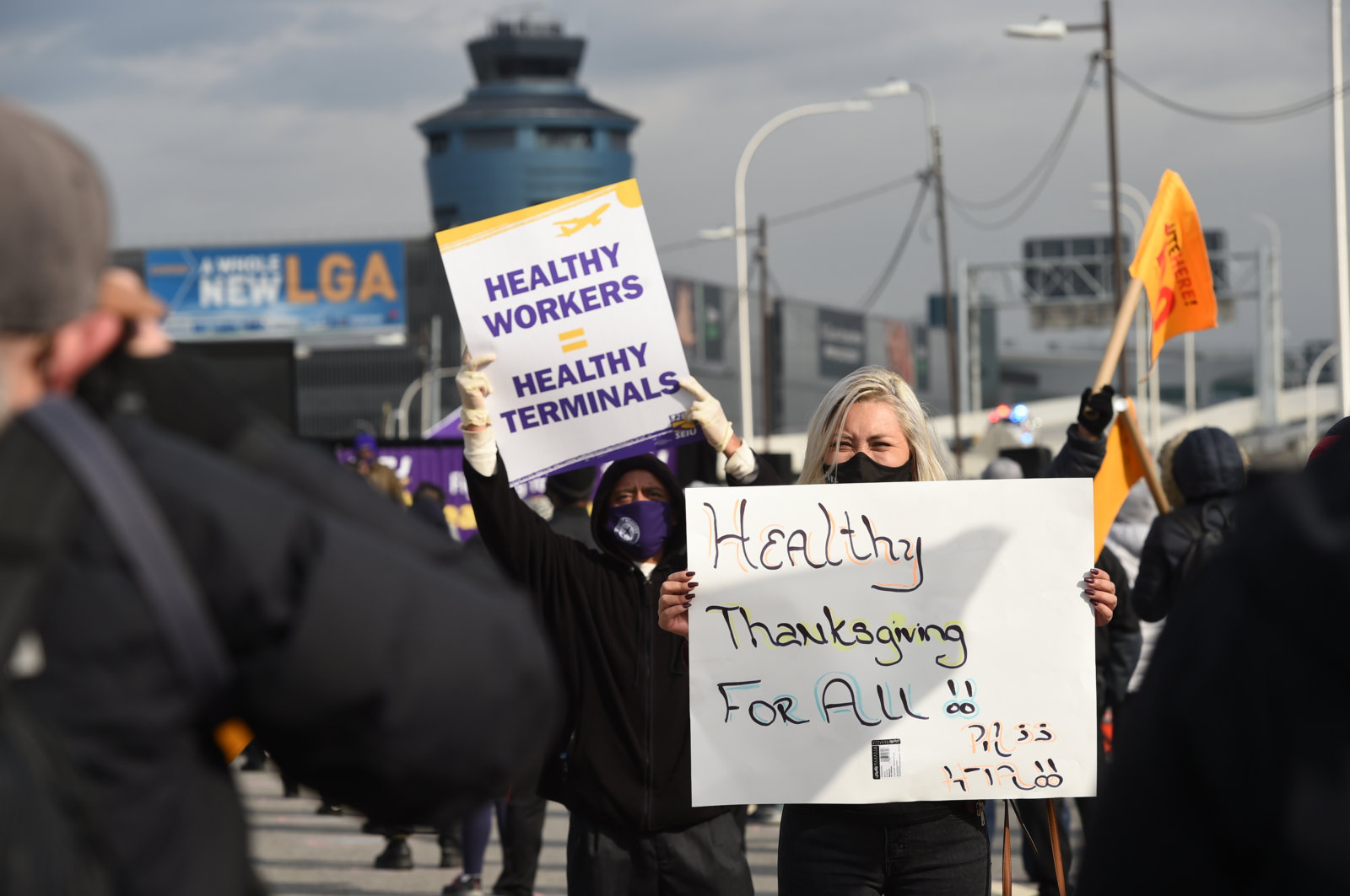 Airport workers rally at LaGuardia seeking benefits through ‘Healthy ...