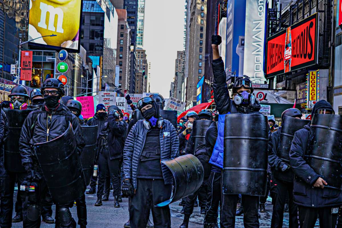 Counter protesters don body armor in anticipation of MAGA march in ...