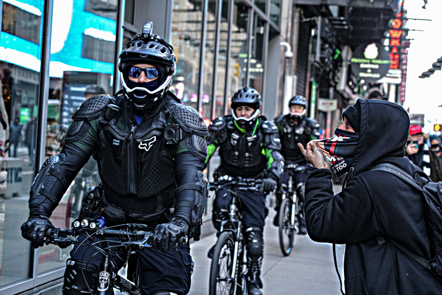 Counter protesters don body armor in anticipation of MAGA march in ...