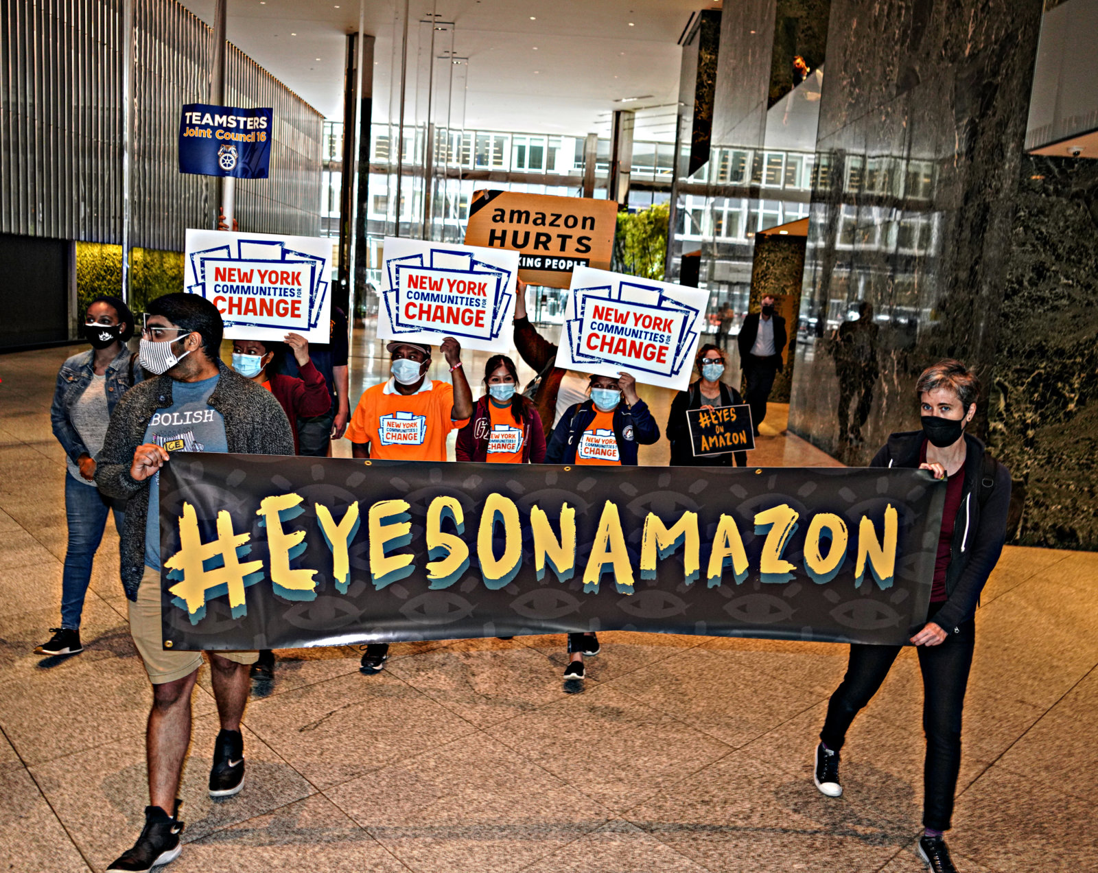 Protesters march into lobby of Amazon investor calling for end in ...