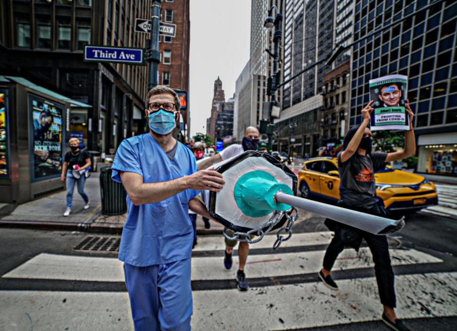 Free the vaccine: Protesters rally outside of Pfizer World Headquarters ...