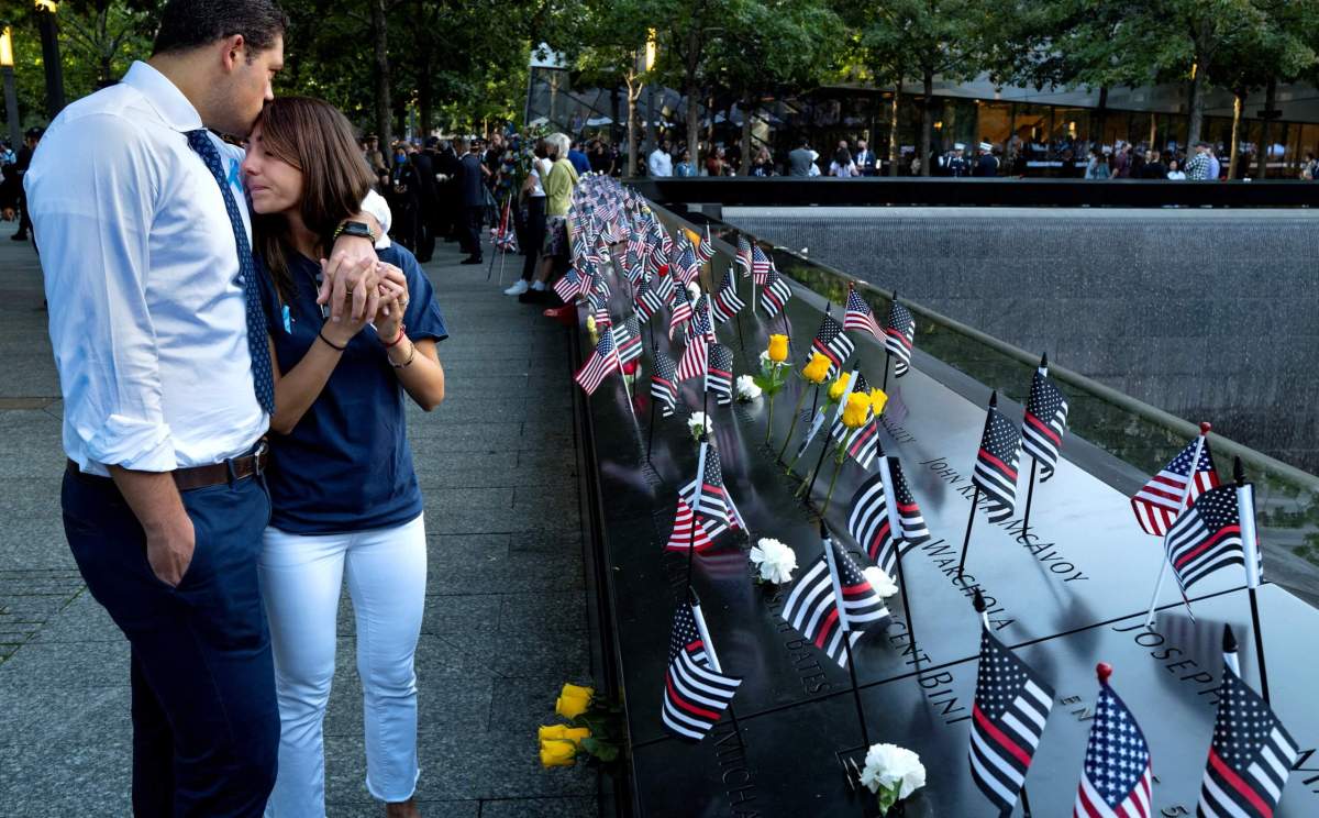 PHOTOS: Tears of grief and remembrance at 9/11 memorial on 20th ...