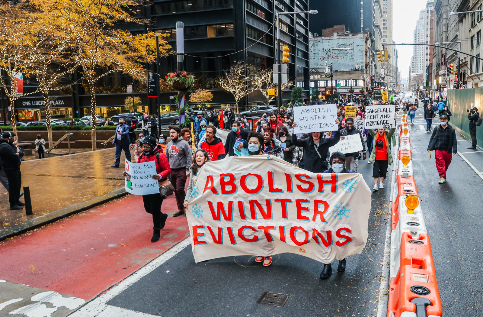 Protesters march through Lower Manhattan calling for an end to winter ...