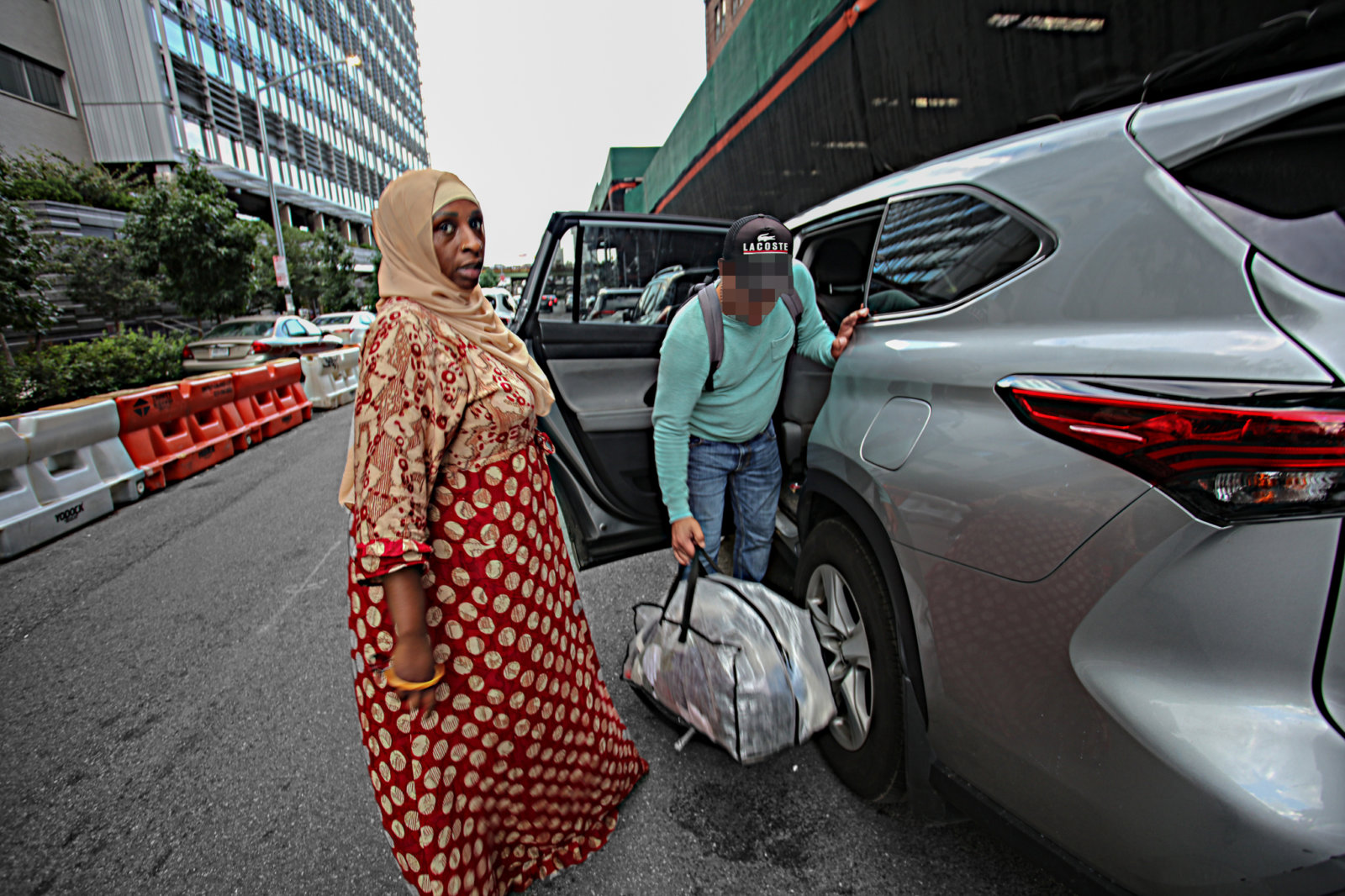Homeless migrants left to sleep on Midtown streets as city shelters ...
