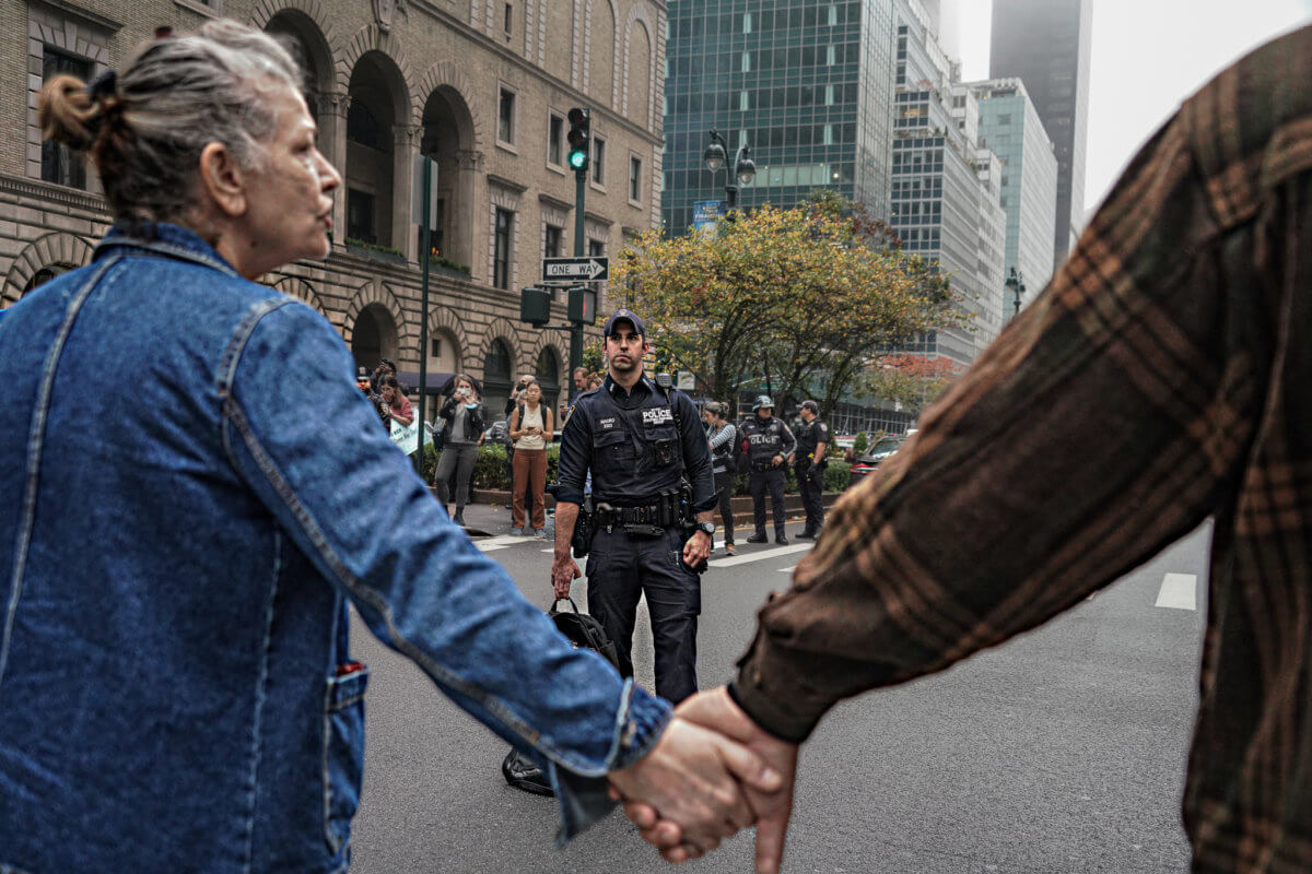 Midtown climate protest ends with 15 activists cuffed for blocking ...