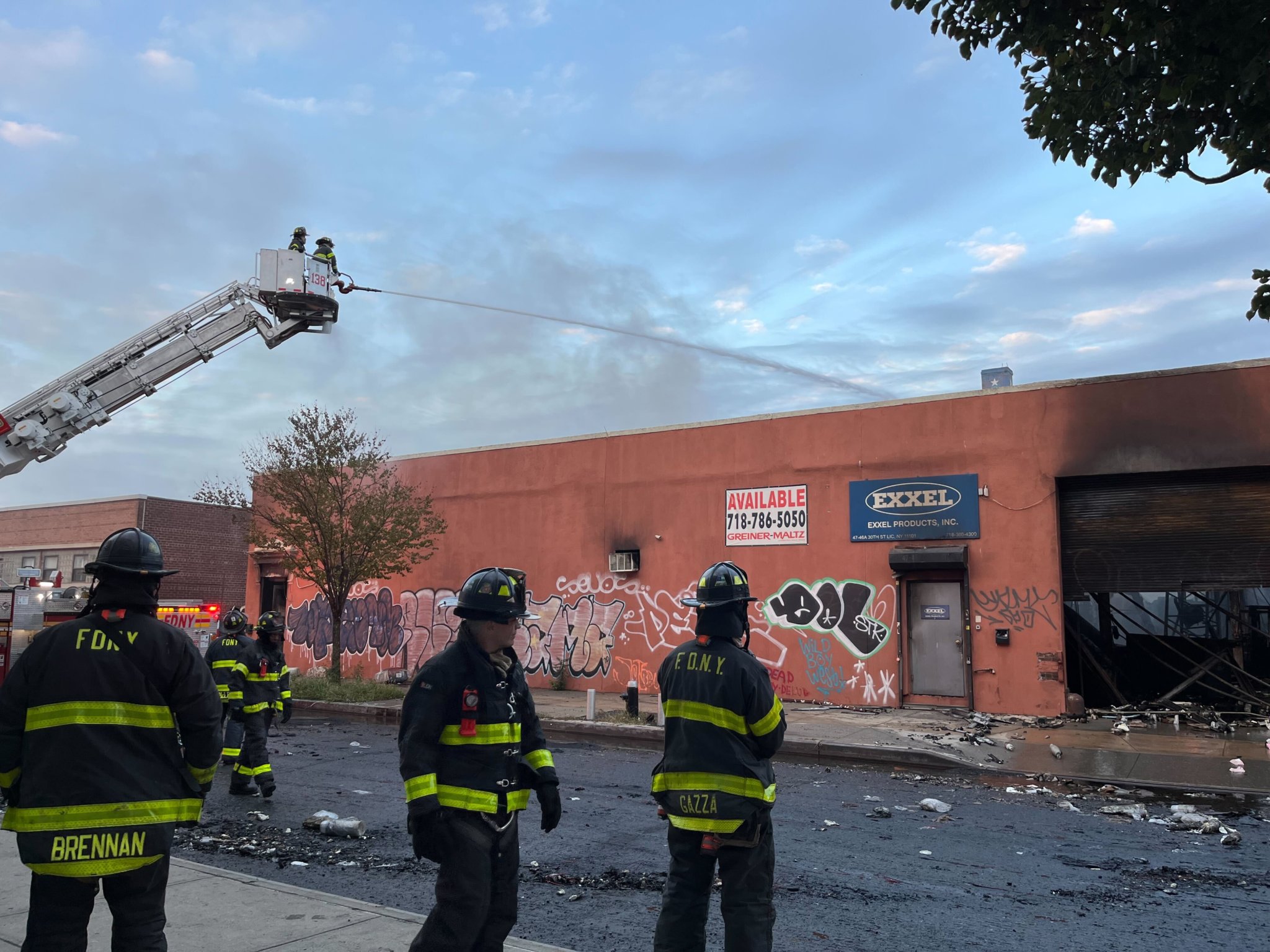 Massive four-alarm fire in Queens guts warehouse, leaves two ...