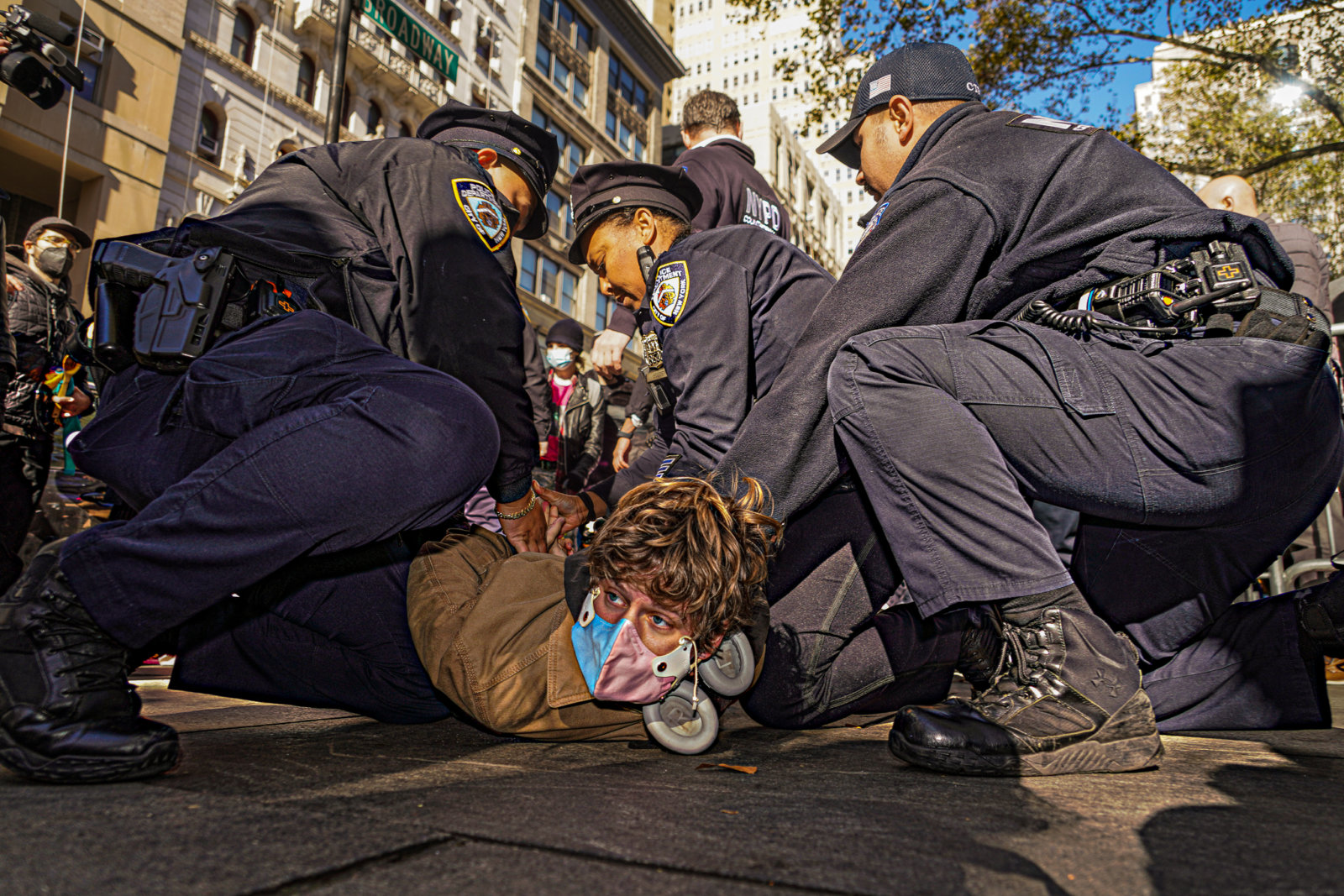 Trans advocates and far-right protesters battle outside of City Hall ...