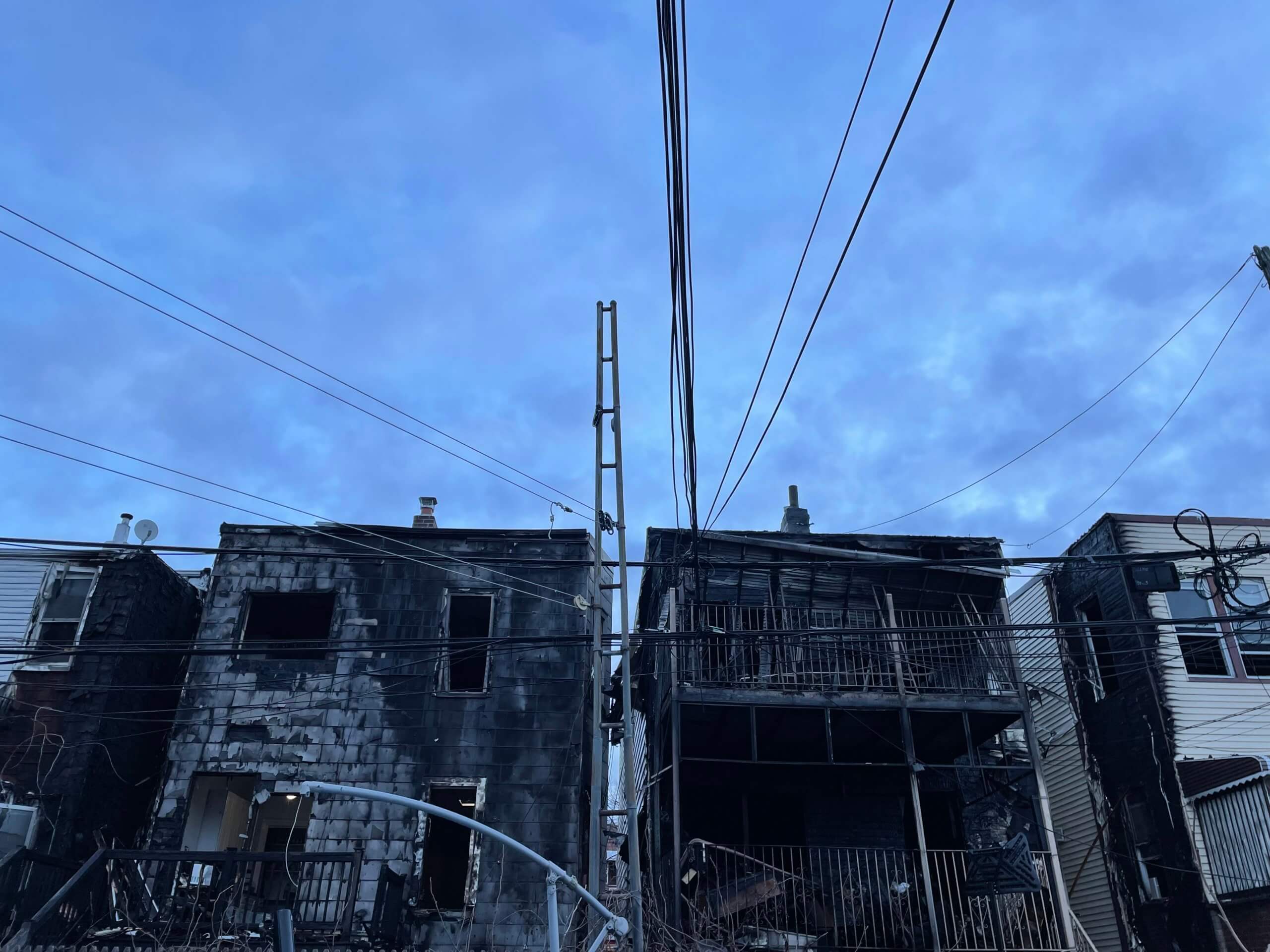 Early morning blaze tears through four Bronx houses, injures two ...