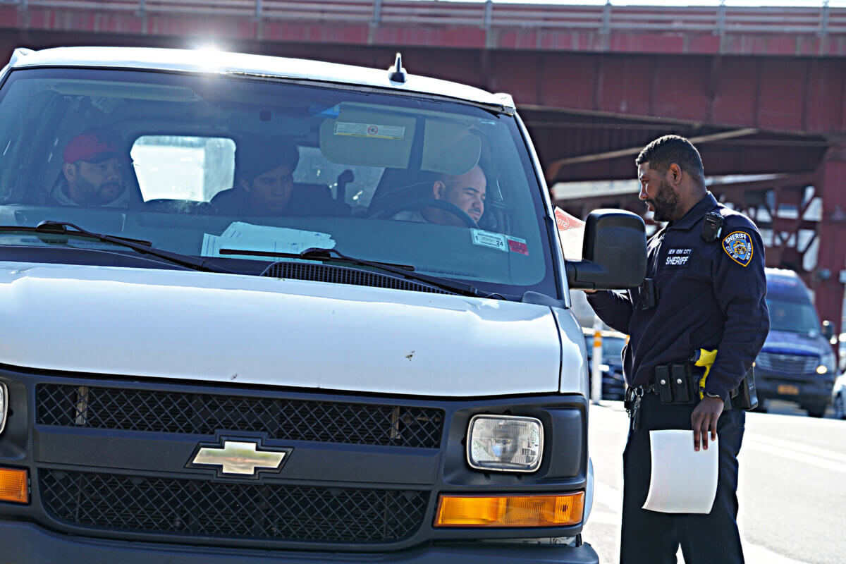 Sheriff seizes vehicles at Queens Midtown Tunnel.