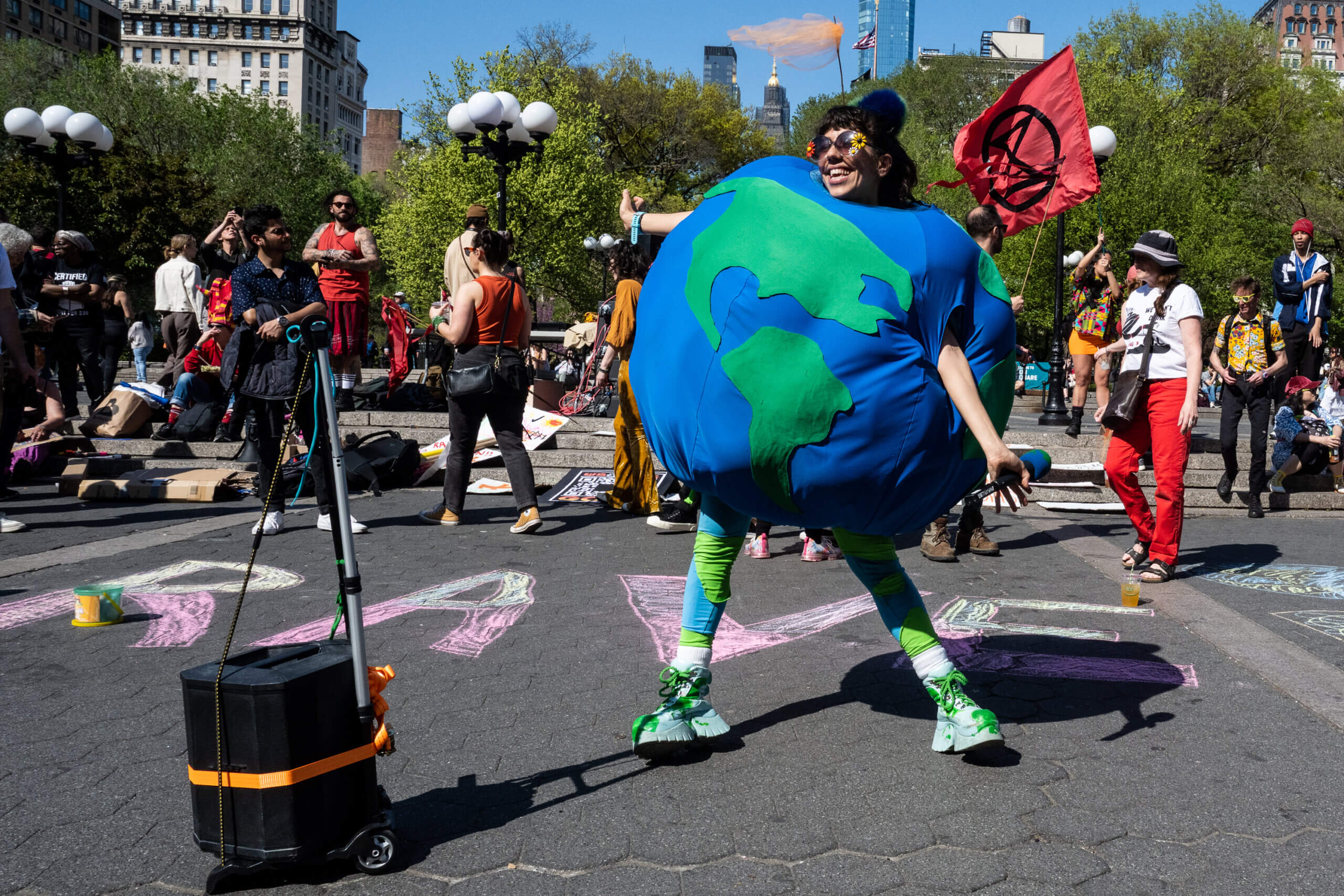 Environmental activists dance against climate and economic injustice at ...